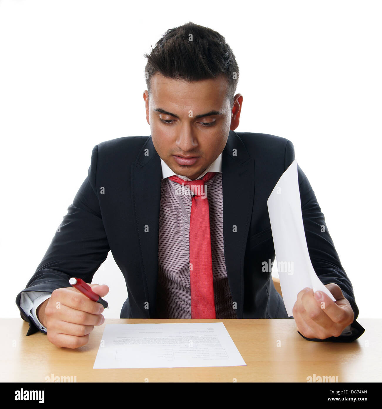 man reading contract at his desk Stock Photo - Alamy