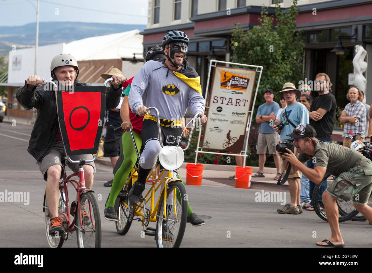 Cyclists in fancy dress taking part in the annual Charity cycle race ...