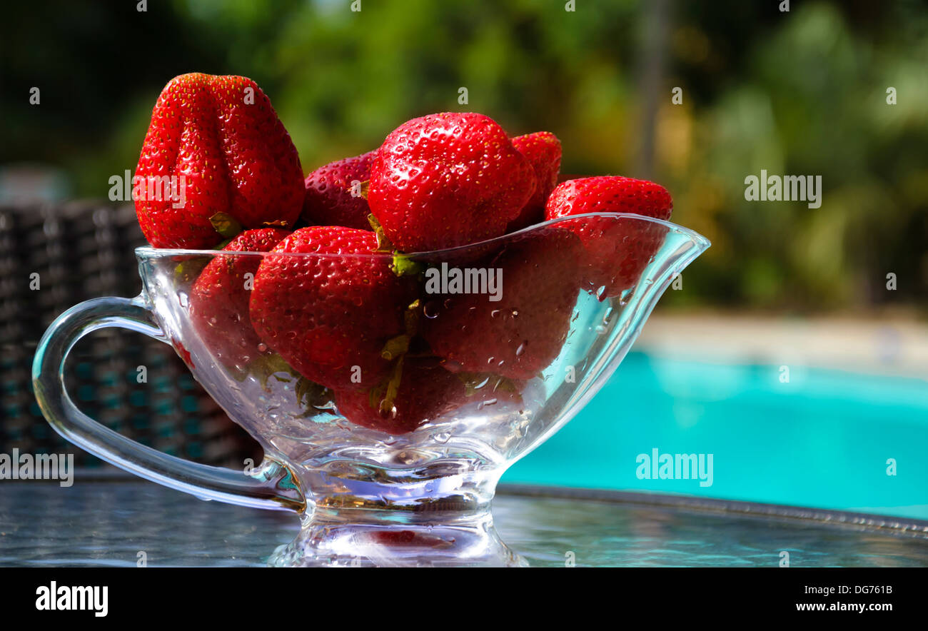 Strawberry on the table by the swimming pool Stock Photo - Alamy