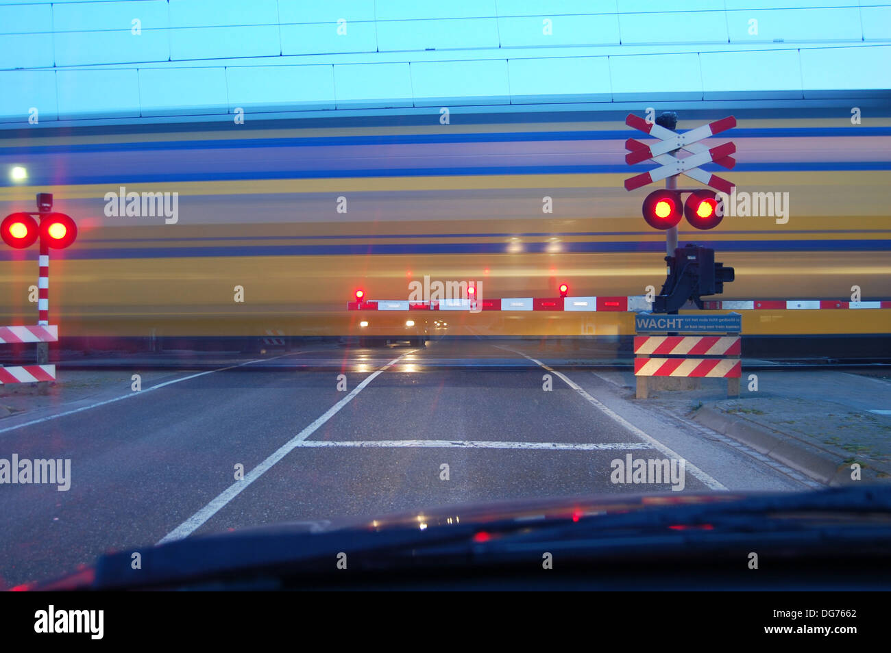 railway crossing and passing train Netherlands Europe Stock Photo - Alamy
