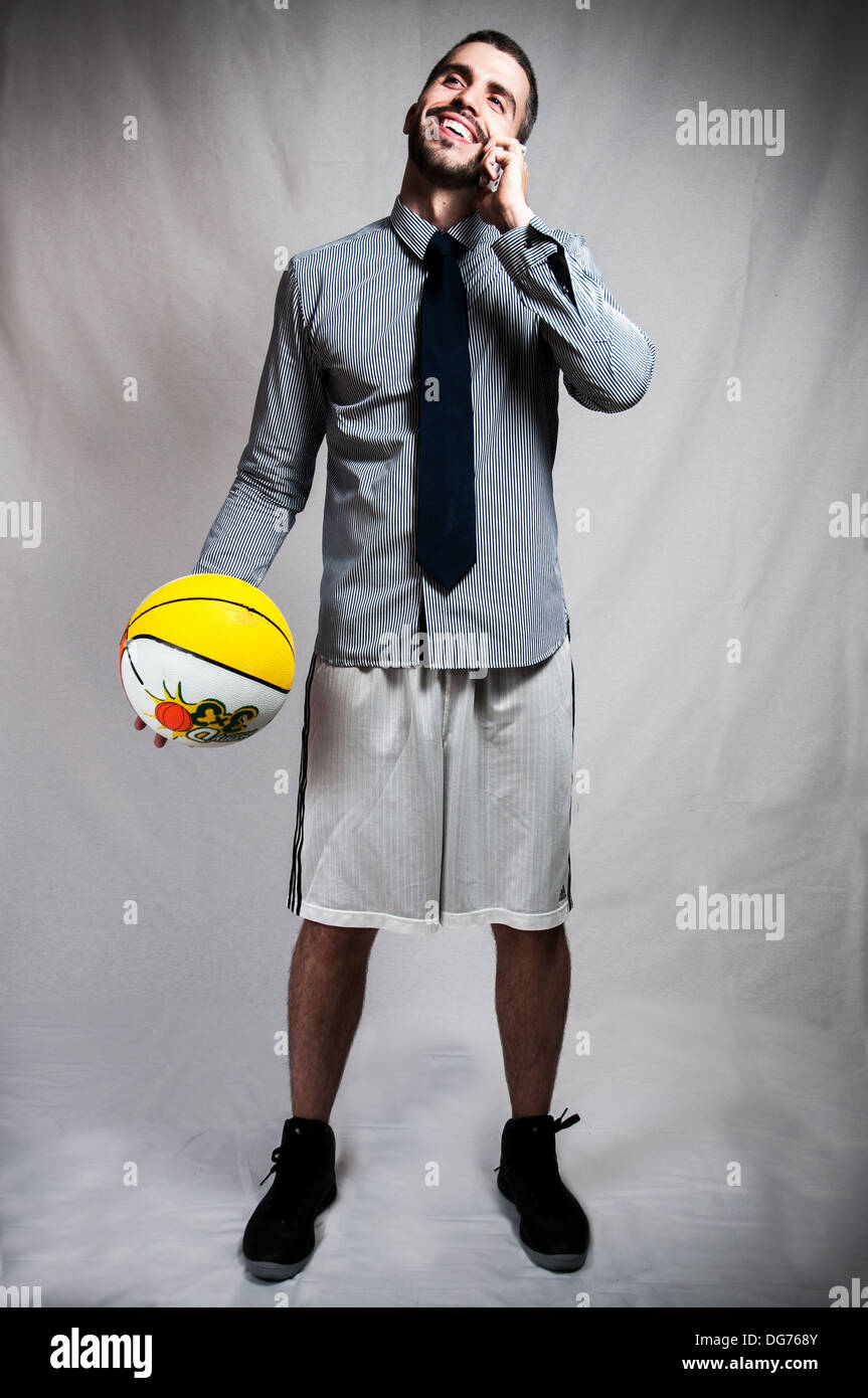 A young model plays basketball in a studio session Stock Photo - Alamy