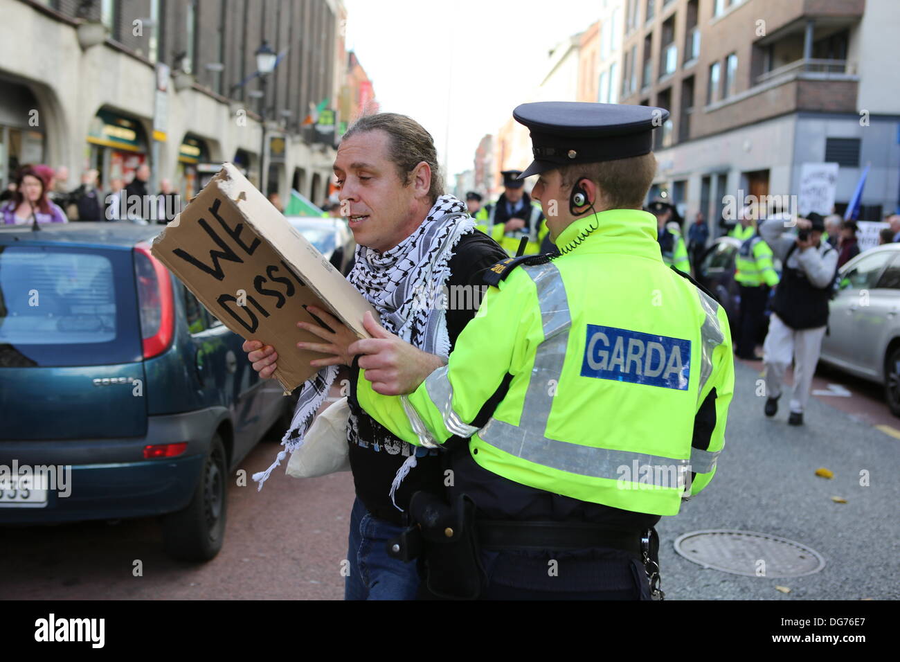 Dublin, Ireland. 15th October 2013. A protester is moved off the street ...