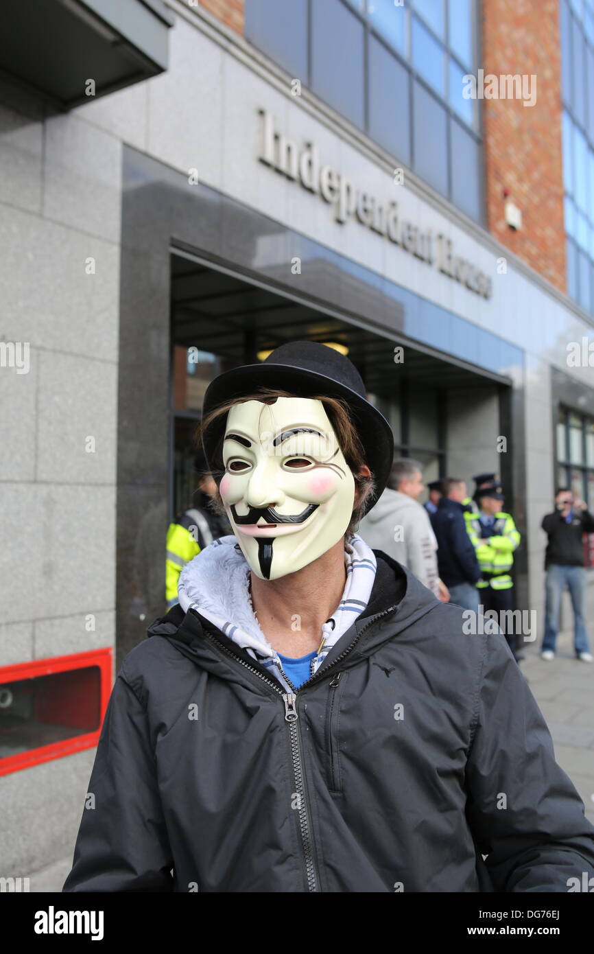 Dublin, Ireland. 15th October 2013. A protester wears a Guy Fawkes mask ...