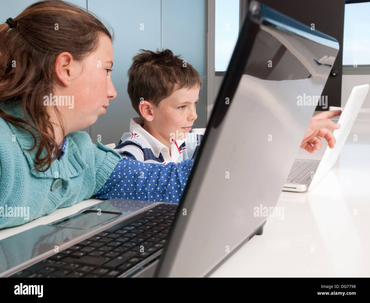 Child helping another child hi-res stock photography and images - Alamy