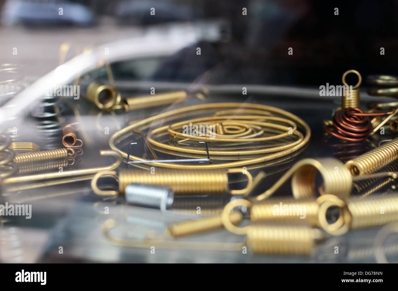 Metal replacement parts in store window Stock Photo - Alamy