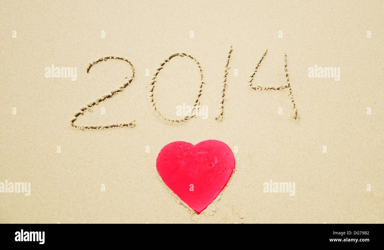 Number 2104 and red Heart shape on sandy the beach Stock Photo - Alamy