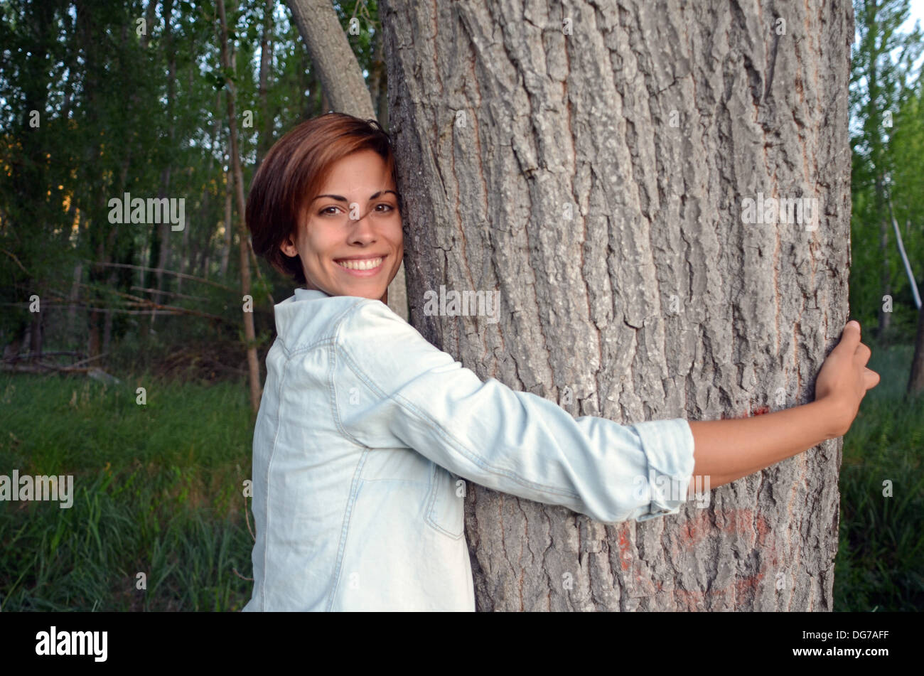 Woman hugging tree hi-res stock photography and images - Alamy
