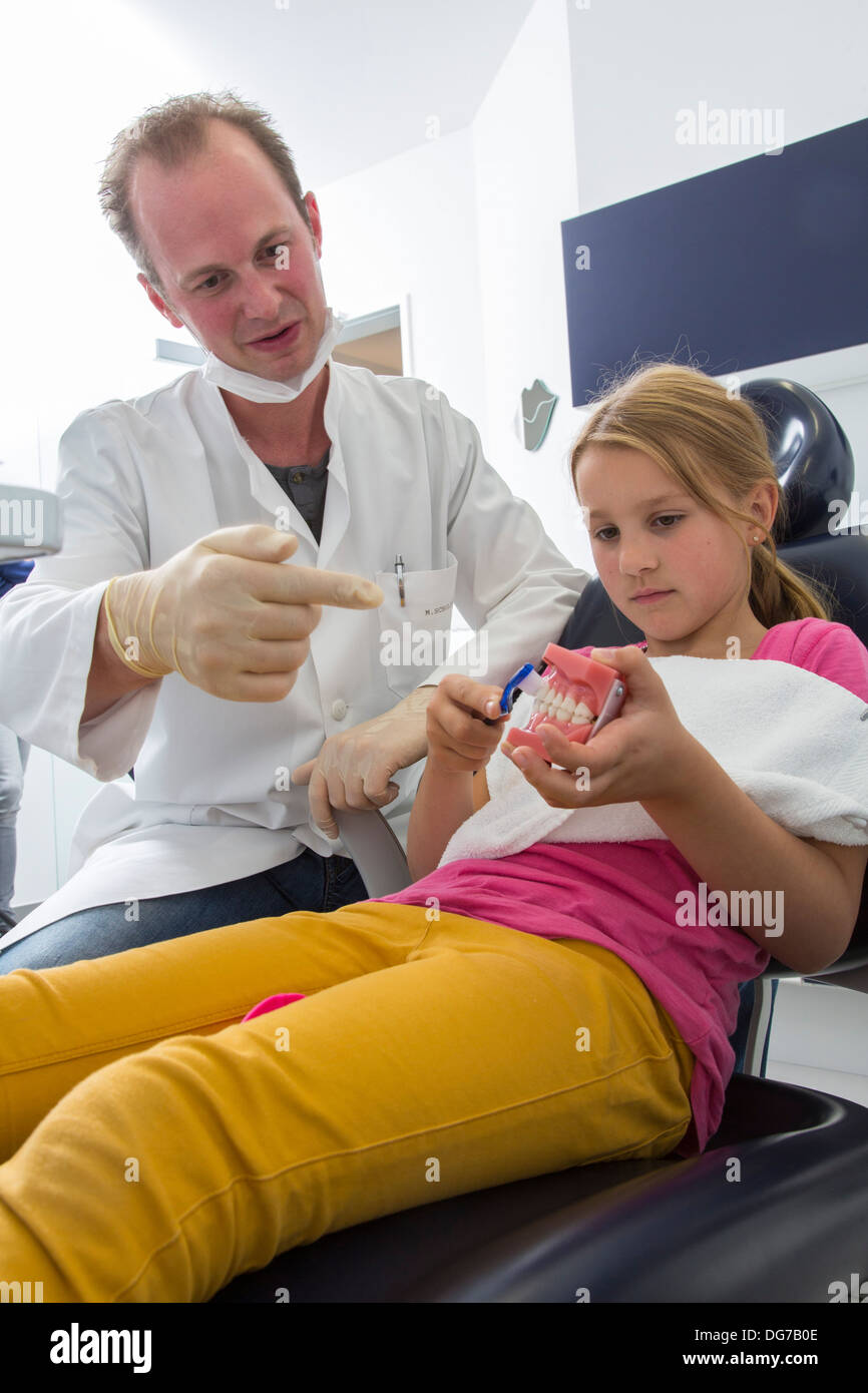 Dental practice, dentistry. Young girl at a dentist treatment Stock ...