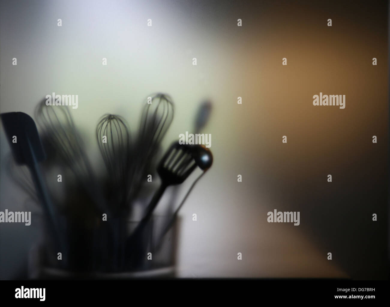 Kitchen tools. blade, brush, skimmer, trough blurry glass Stock Photo ...