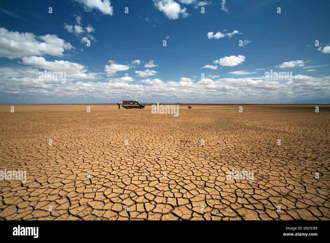 A Land Cruiser and two people at the Chalbi Desert, Northern Kenya ...