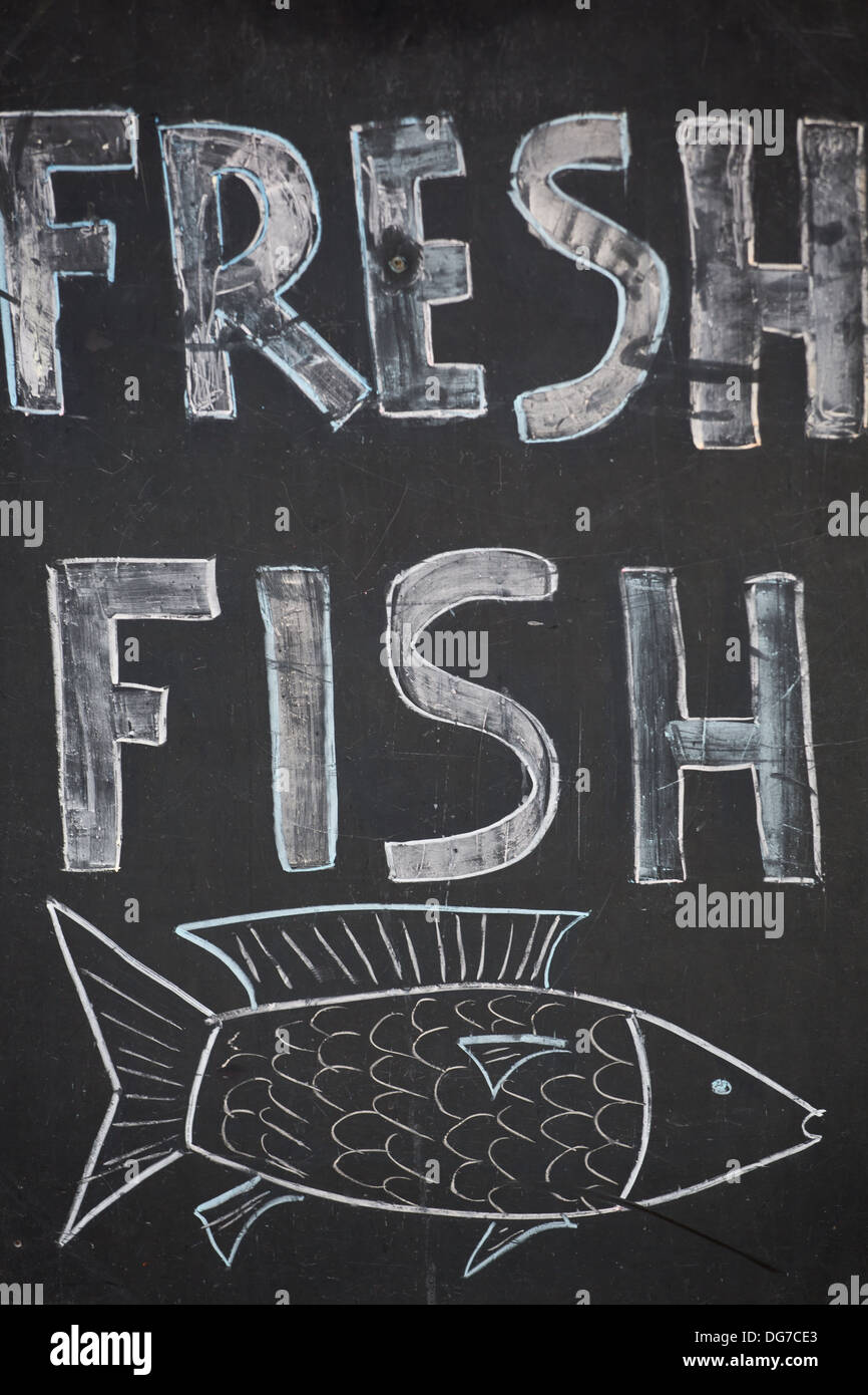 A Handwritten sign promoting fresh fish . fish is such an important ...