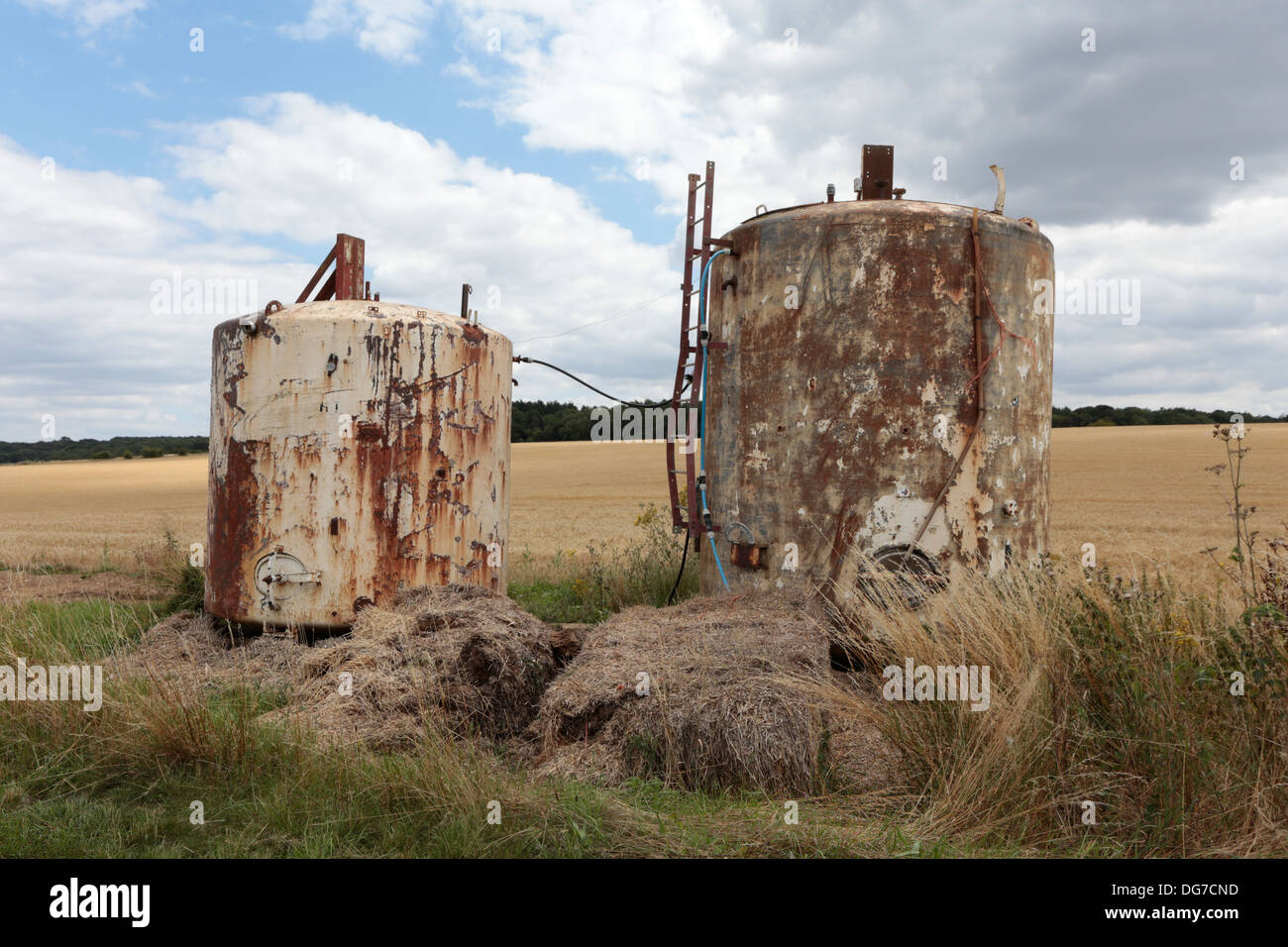 Two rusty storage tanks on farmland in Oxfordshire Stock Photo - Alamy