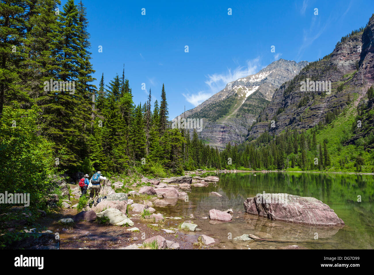 Hikers on the shore of Avalanche Lake, Glacier National Park, Montana ...