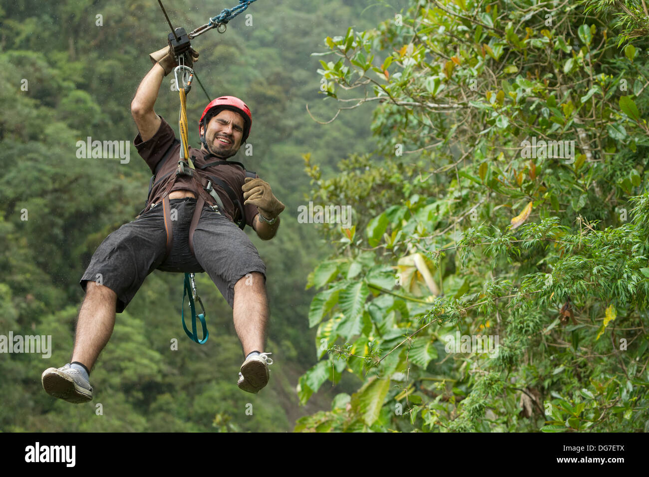 Adult Man Zip Line Adventure In Ecuadorian Rainforest Stock Photo - Alamy