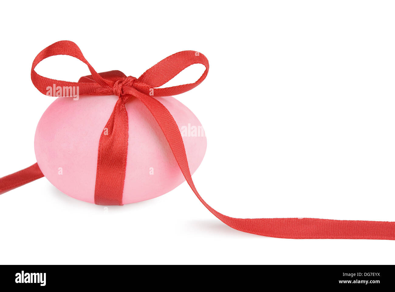 Pink Easter egg with a red ribbon isolated on white background Stock ...