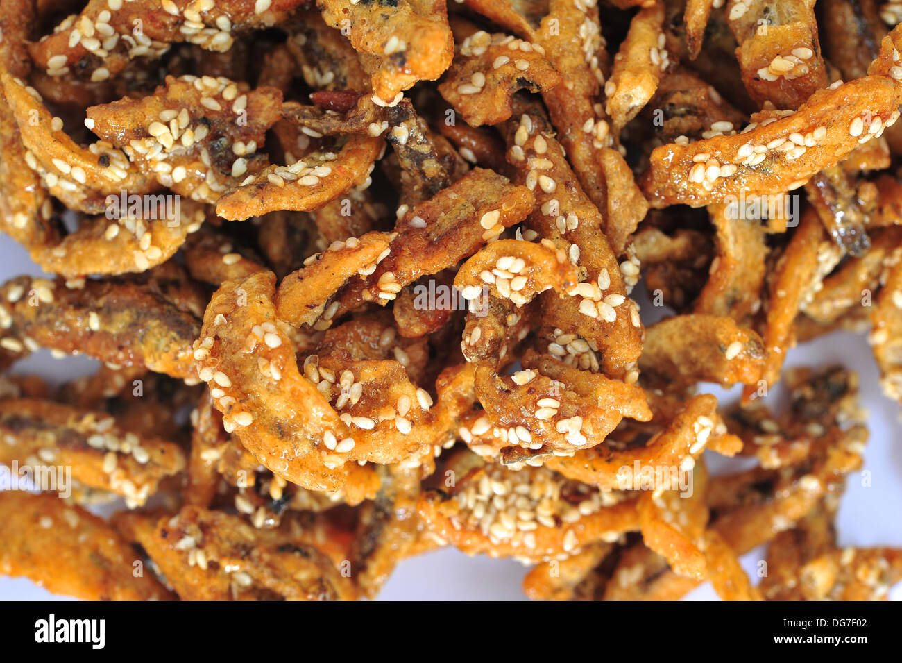 Fried anchovies sprinkle sesame Stock Photo - Alamy