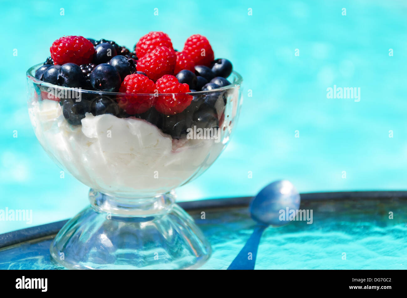 Morning dessert with fresh berries by the swimming pool Stock Photo - Alamy