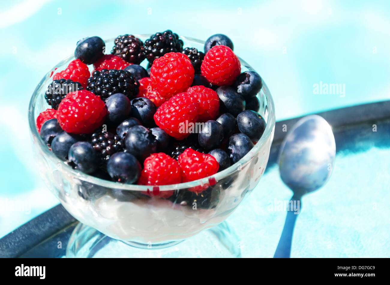 Morning dessert with fresh berries by the swimming pool Stock Photo - Alamy