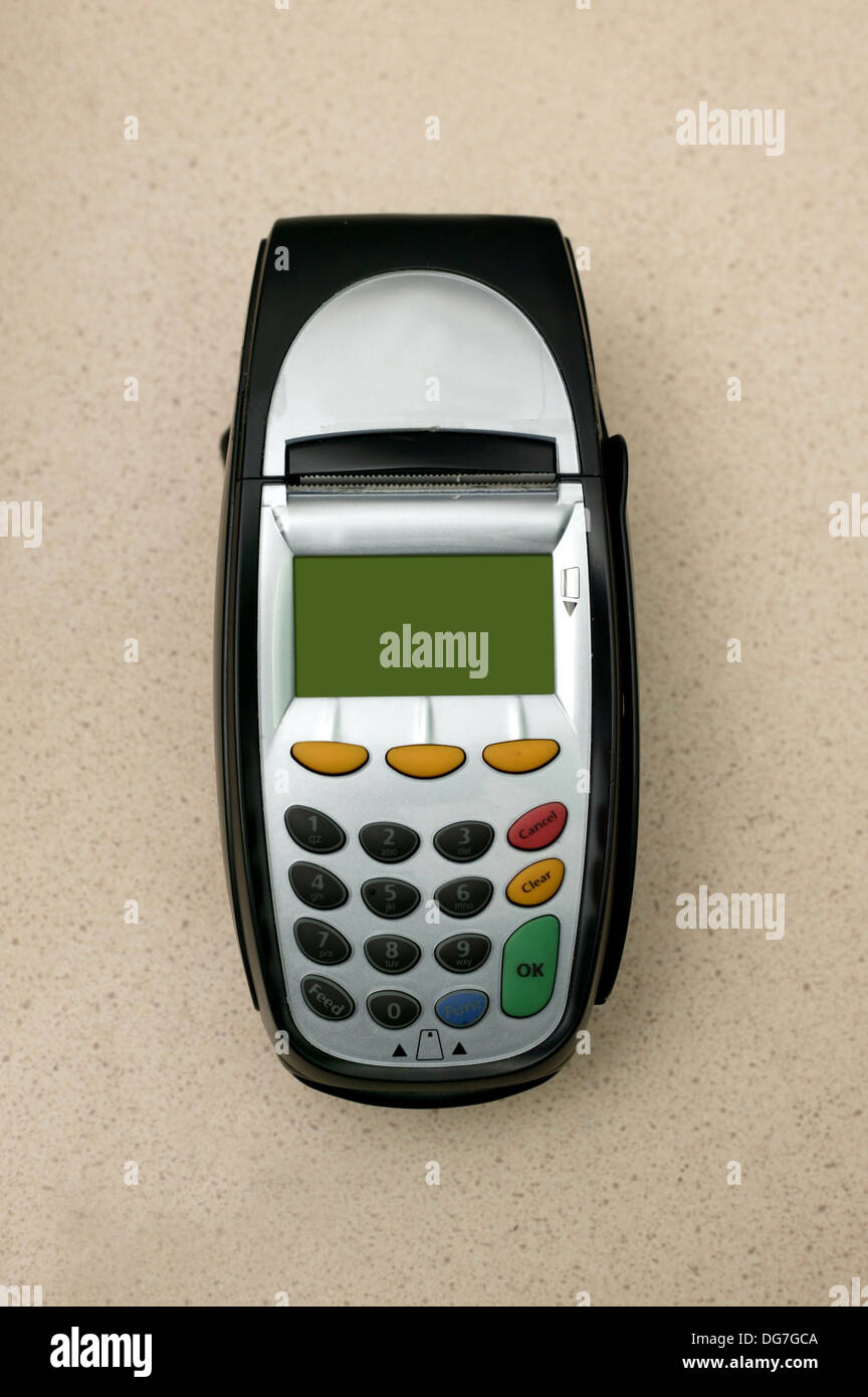 A eftpos machine on a plain background Stock Photo - Alamy