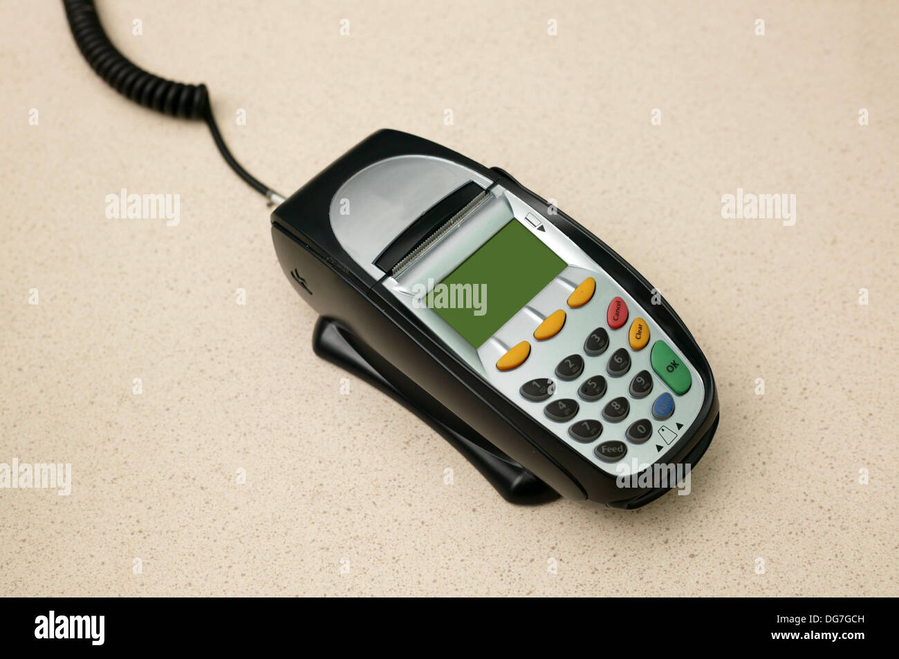 A eftpos machine on a plain background Stock Photo - Alamy