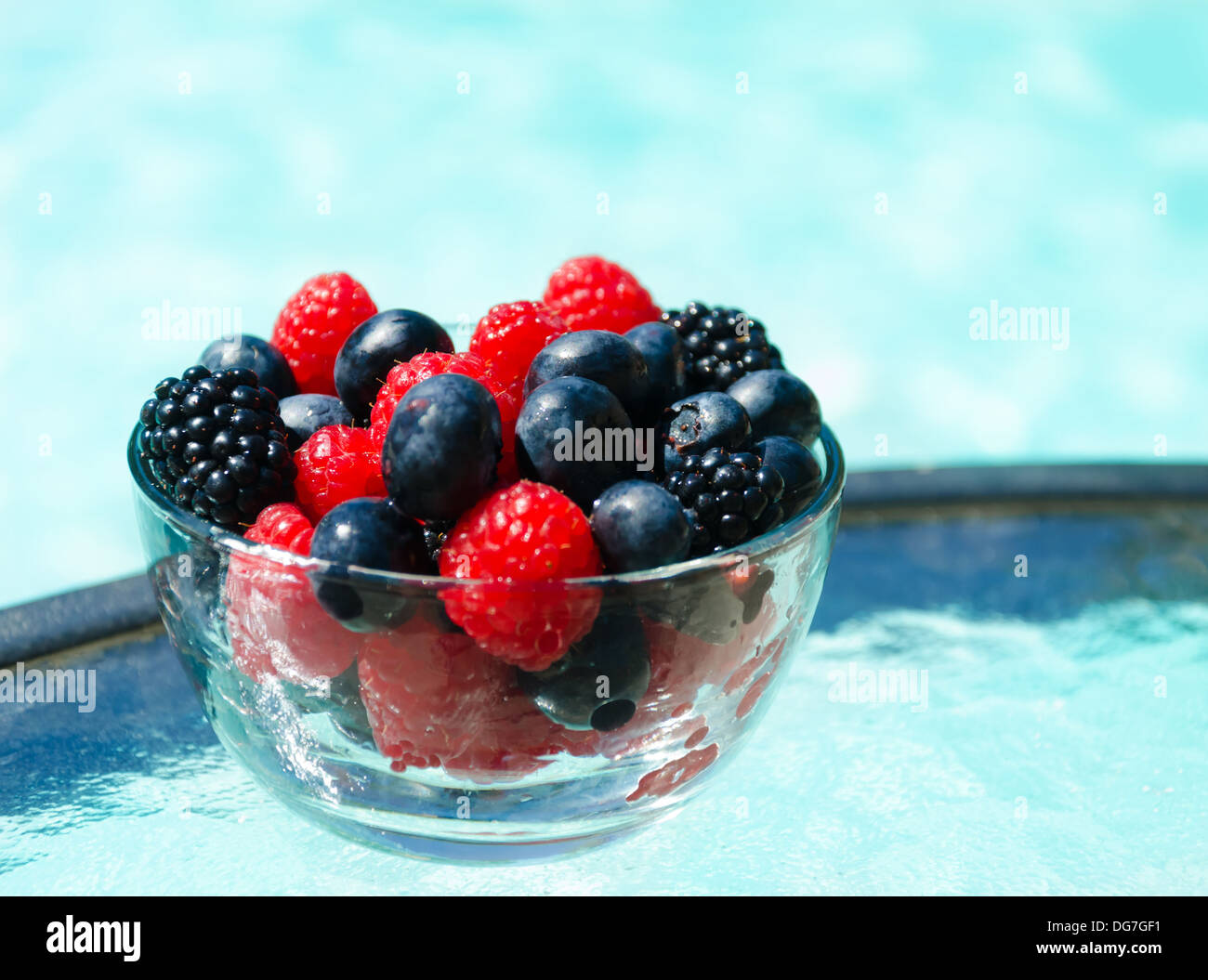 Fresh berries by the swimming pool in sunny morning Stock Photo - Alamy