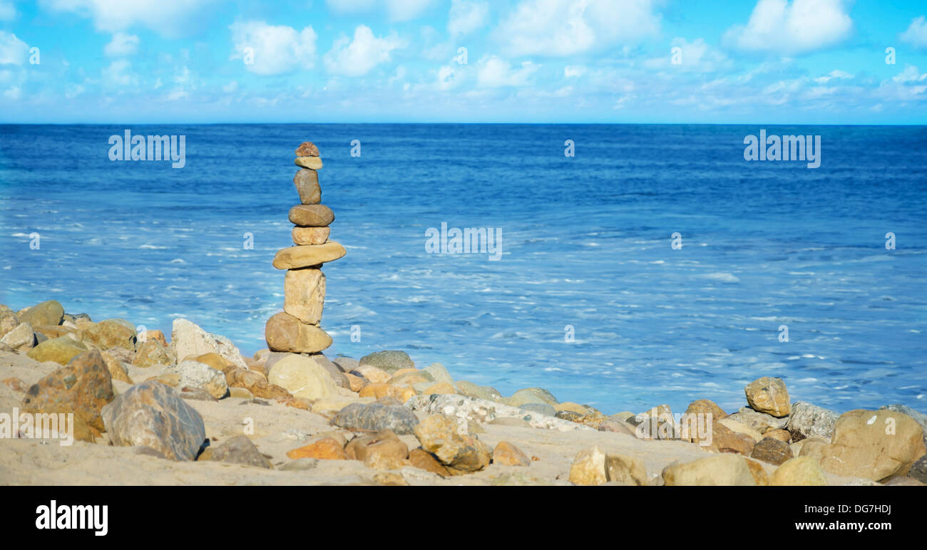 Stack of sea rocks balancing by Pacific ocean Stock Photo - Alamy