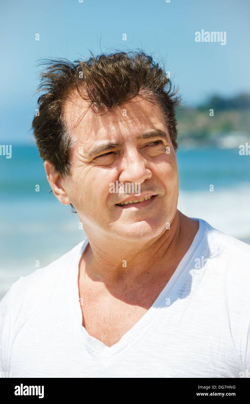 Portrait of a happy greek man on beach Stock Photo - Alamy