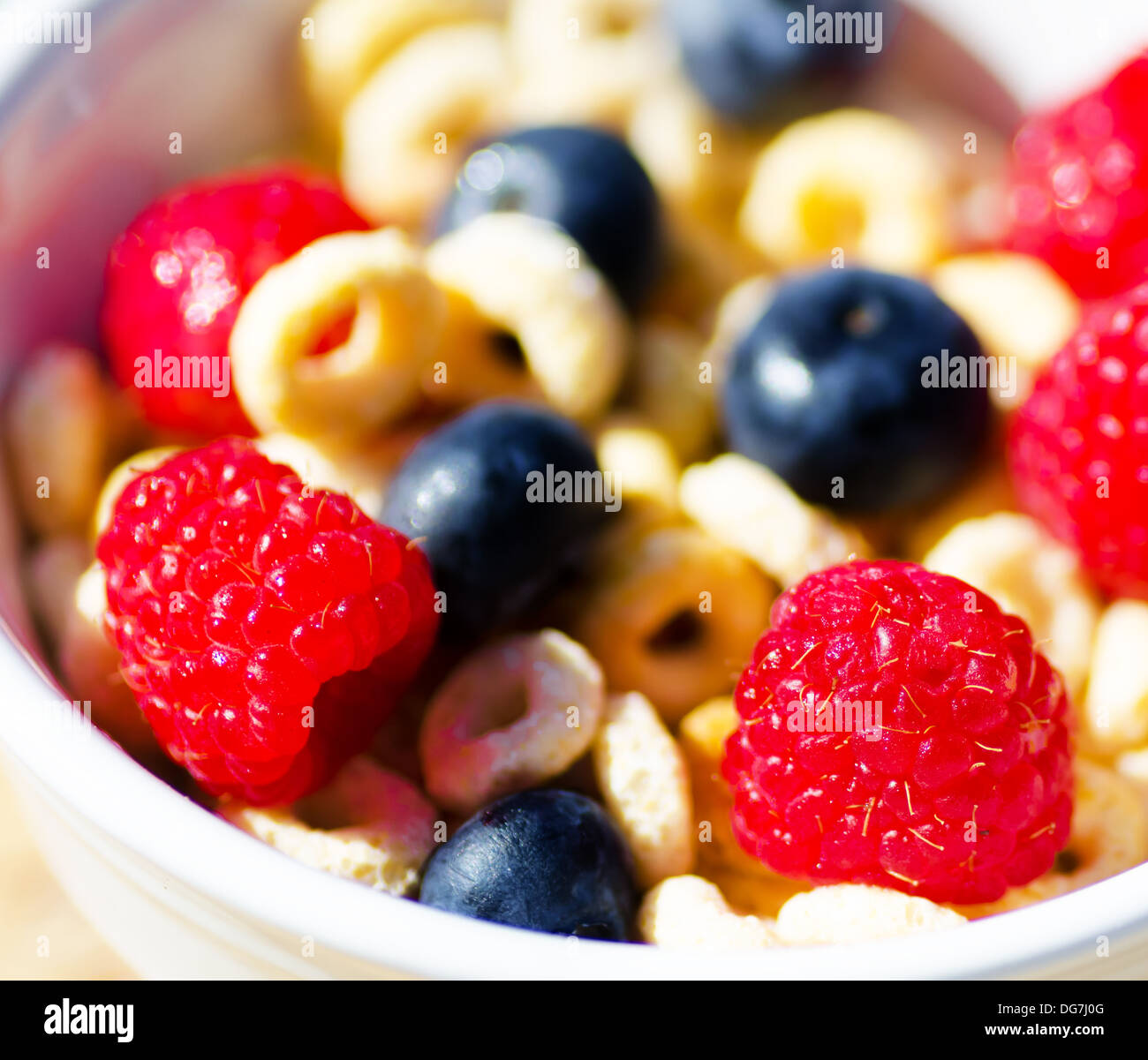 Healthy breakfast with cereals, blueberry, raspberry. Selective focus ...