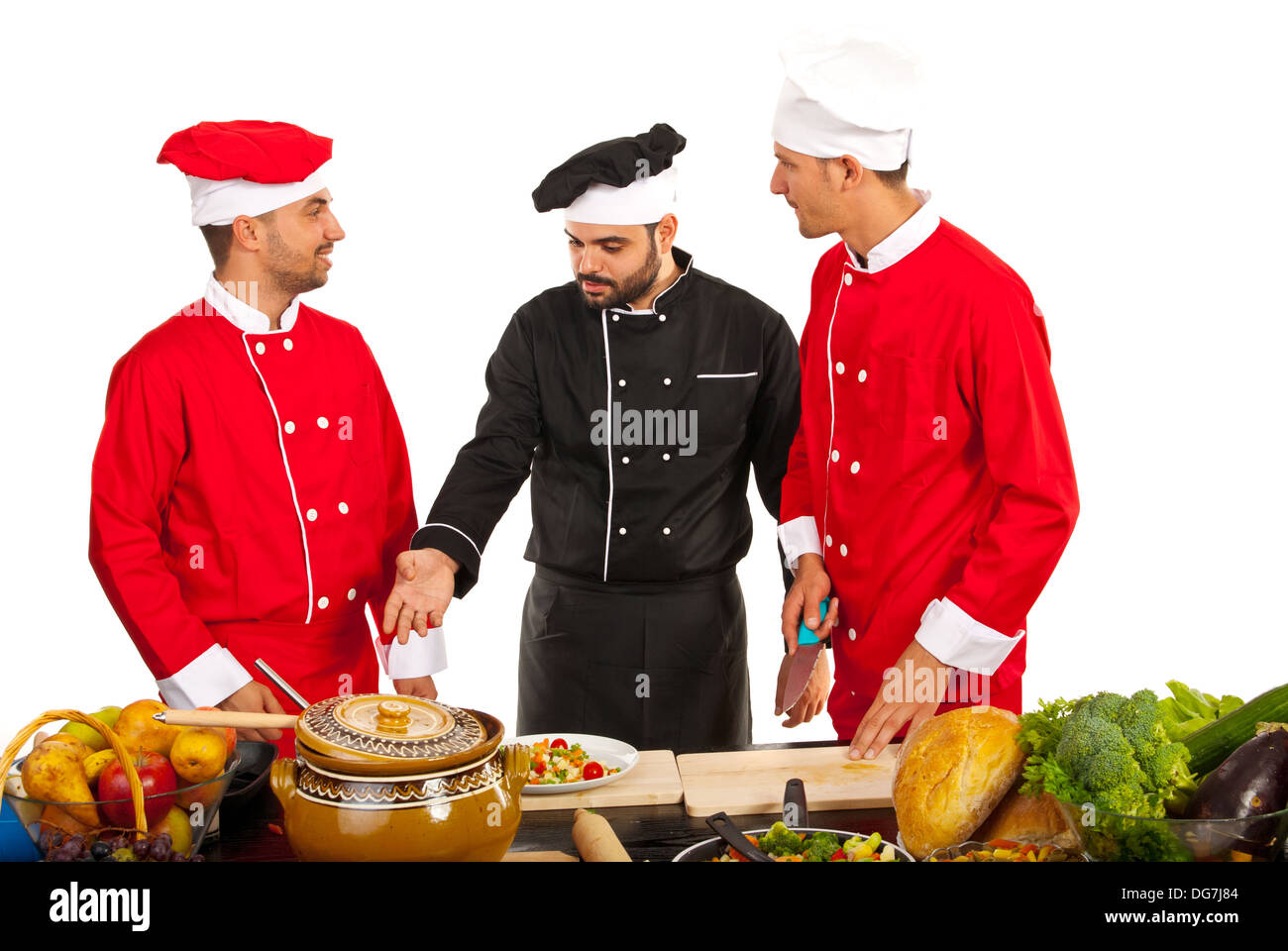 Teacher chef having conversation with students in kitchen Stock Photo ...