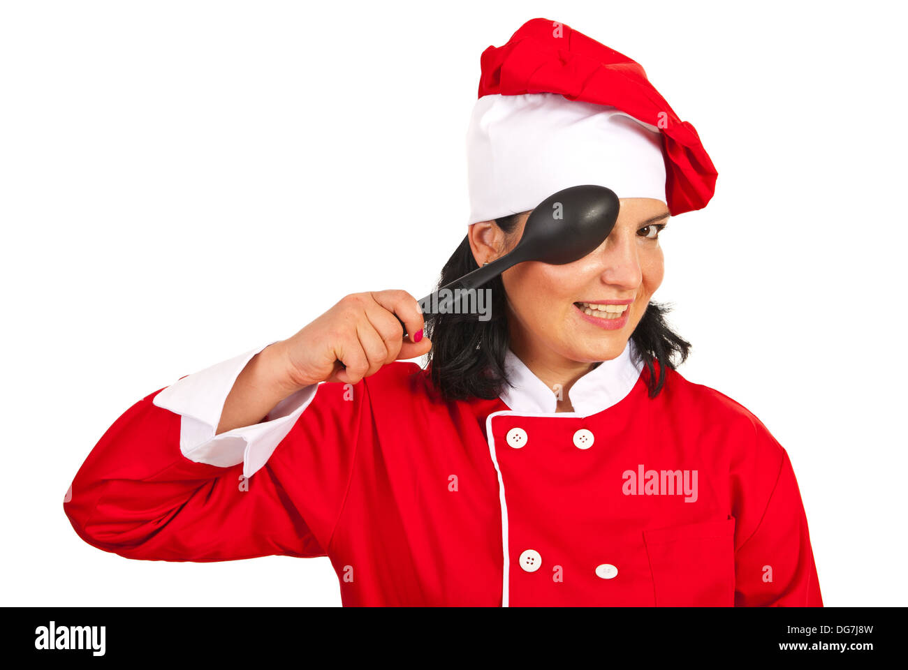 Happy chef woman holding big spoon in front of eye isolated on white ...