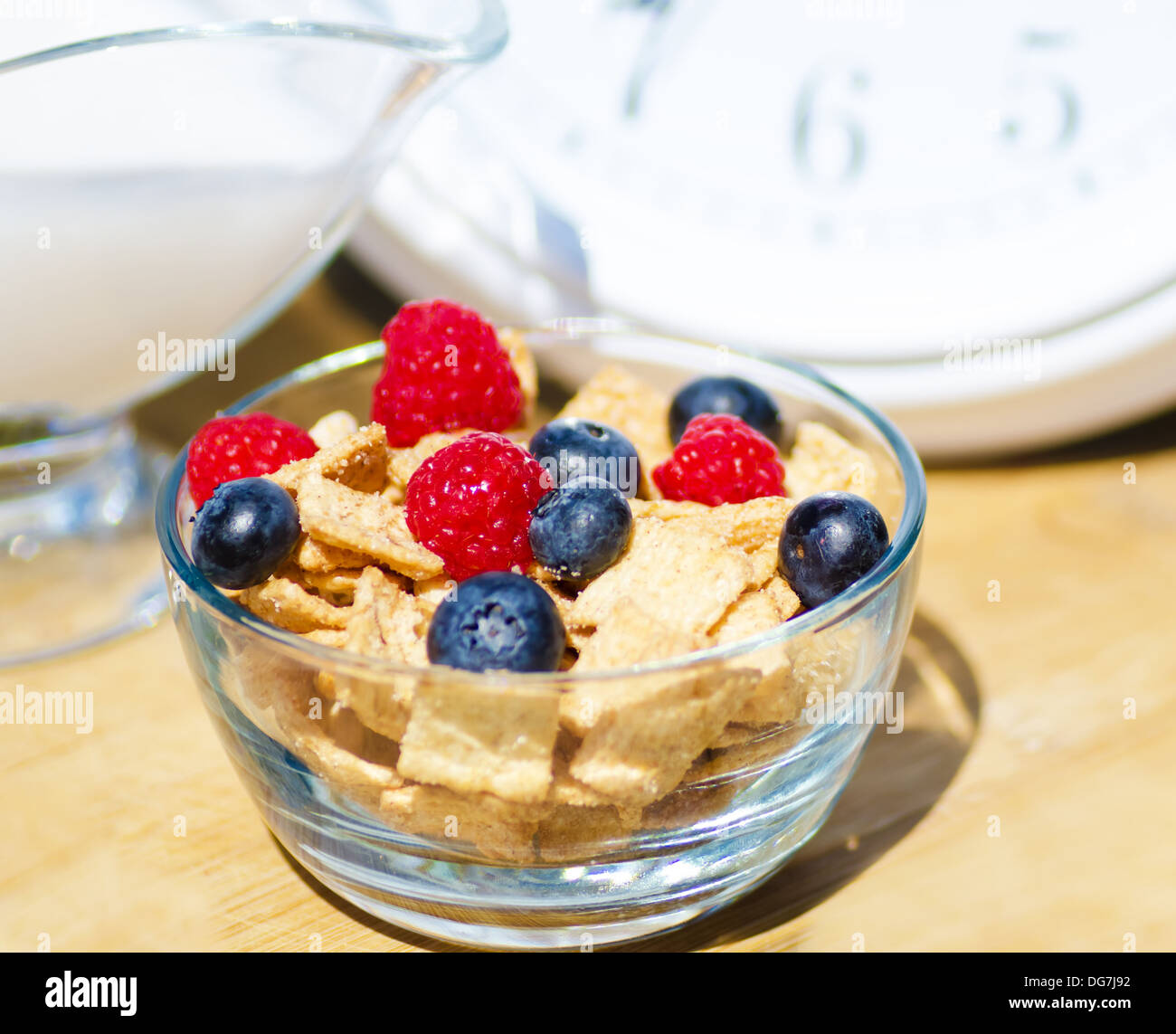 Healthy breakfast with cereals, blueberry, raspberry and milk ...
