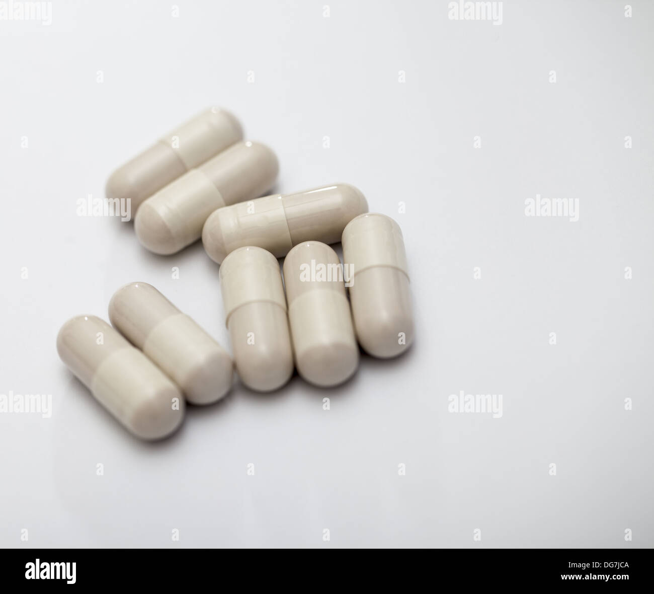 White medicine capsules on whitebackground Stock Photo - Alamy