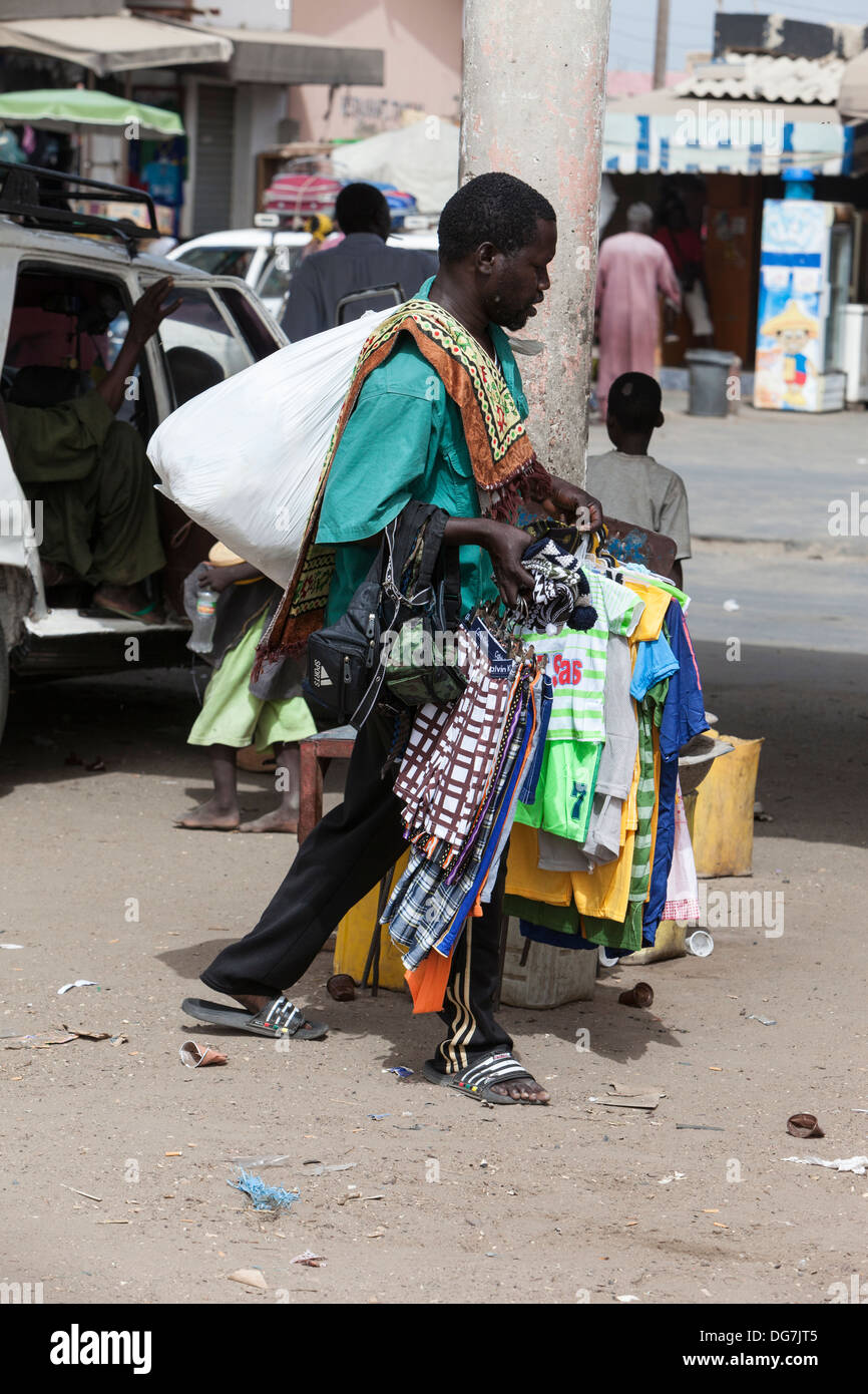 Senegal, Saint Louis. Vendor of Children's Clothing Items at Bus ...