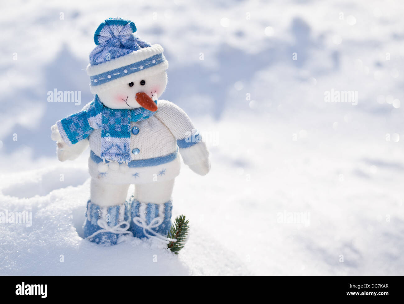 Little snowman with carrot nose in the snow Stock Photo - Alamy