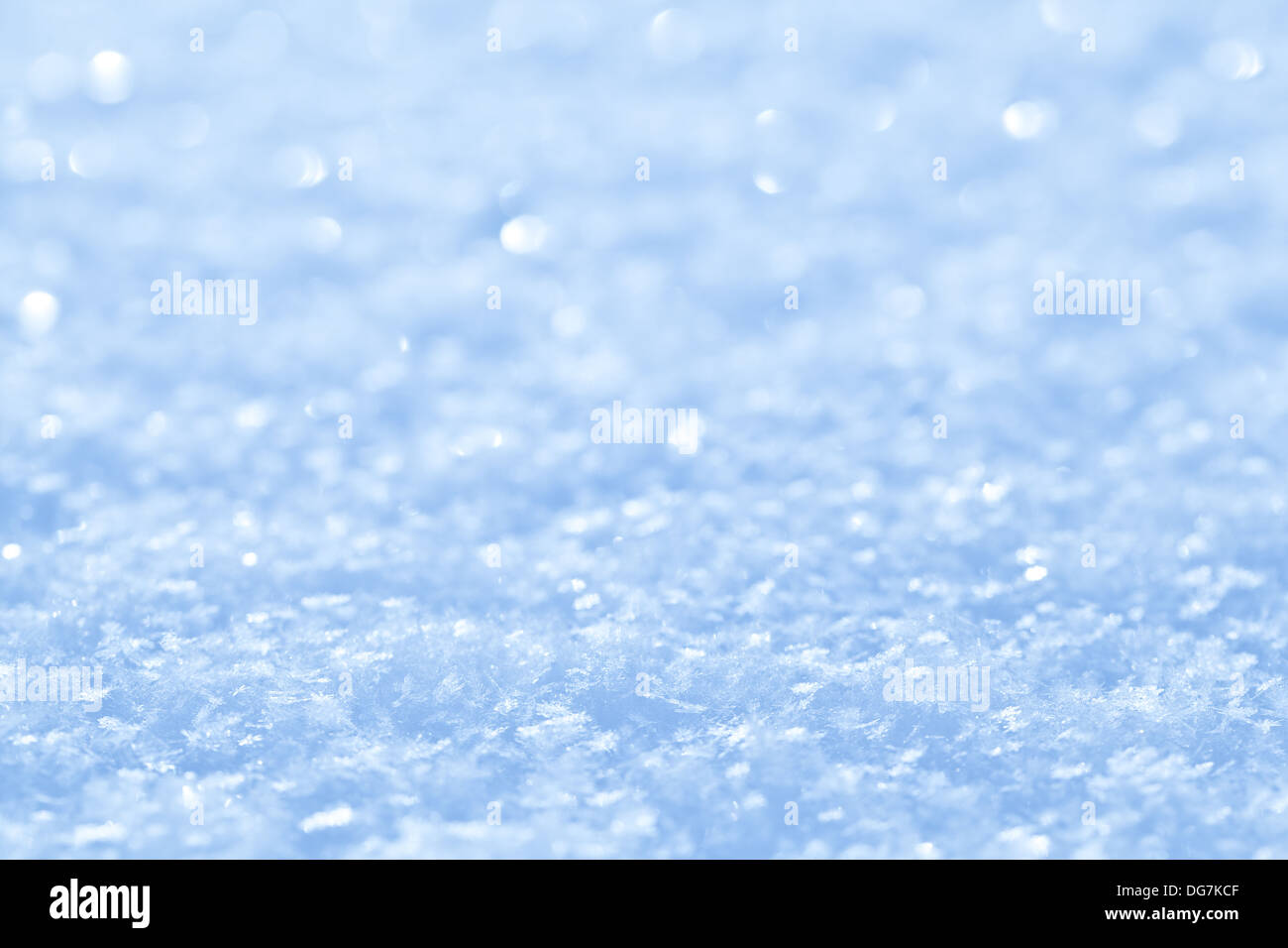 Blue sparkling snow background with white little snowflakes Stock Photo ...