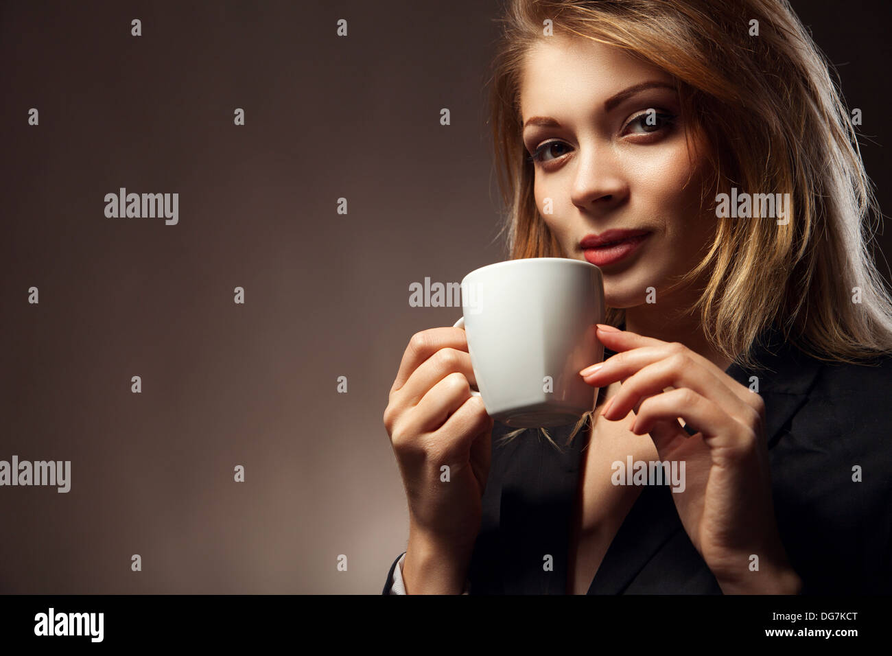 Beautiful Girl Drinking Tea or Coffee Stock Photo - Alamy