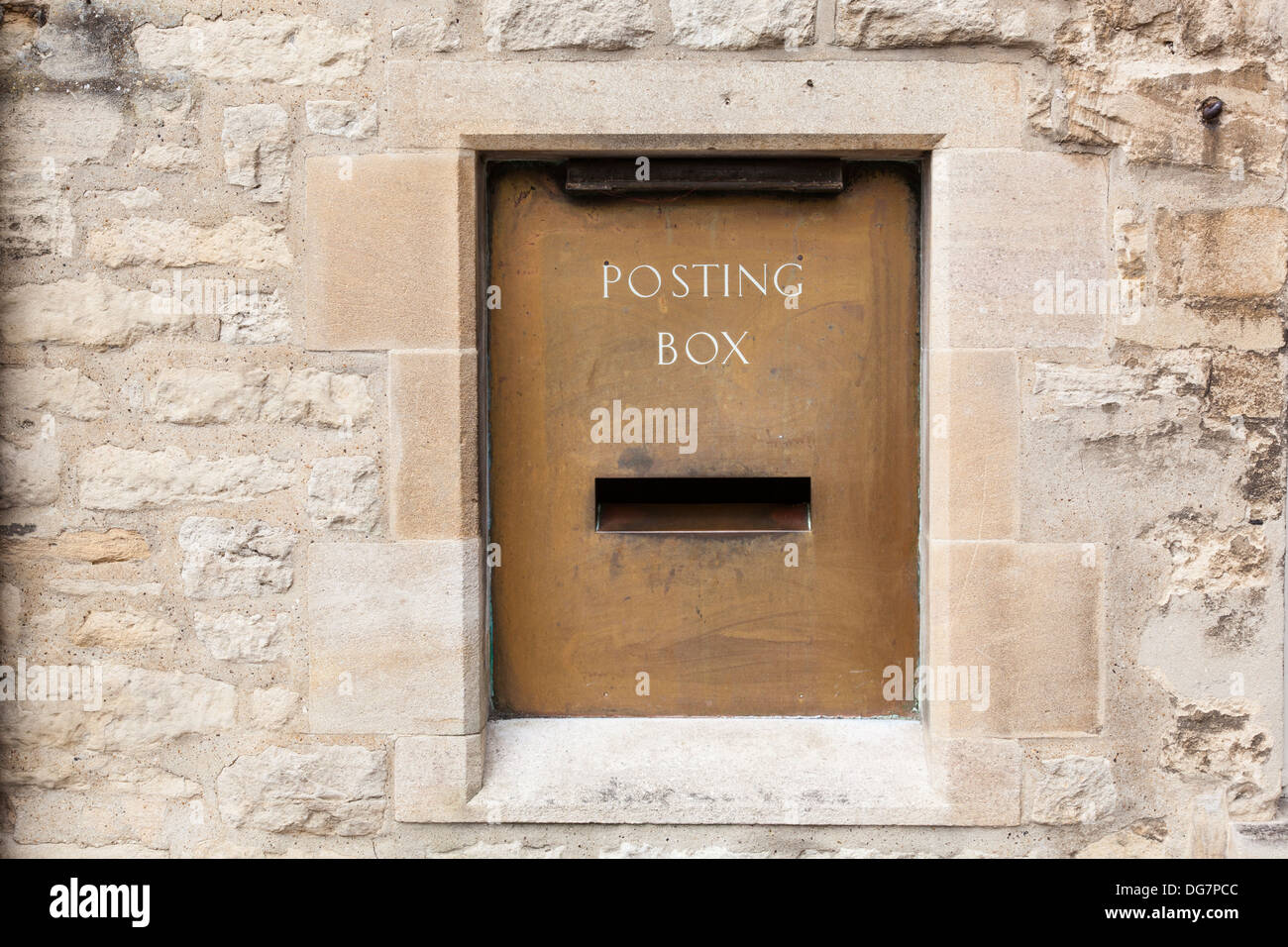 Metal posting box inset in a stone wall Stock Photo - Alamy