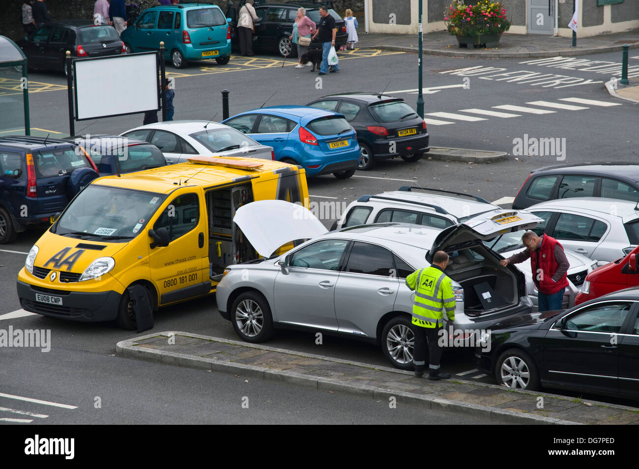 AA patrolman attending to breakdown in car park Llandovery ...