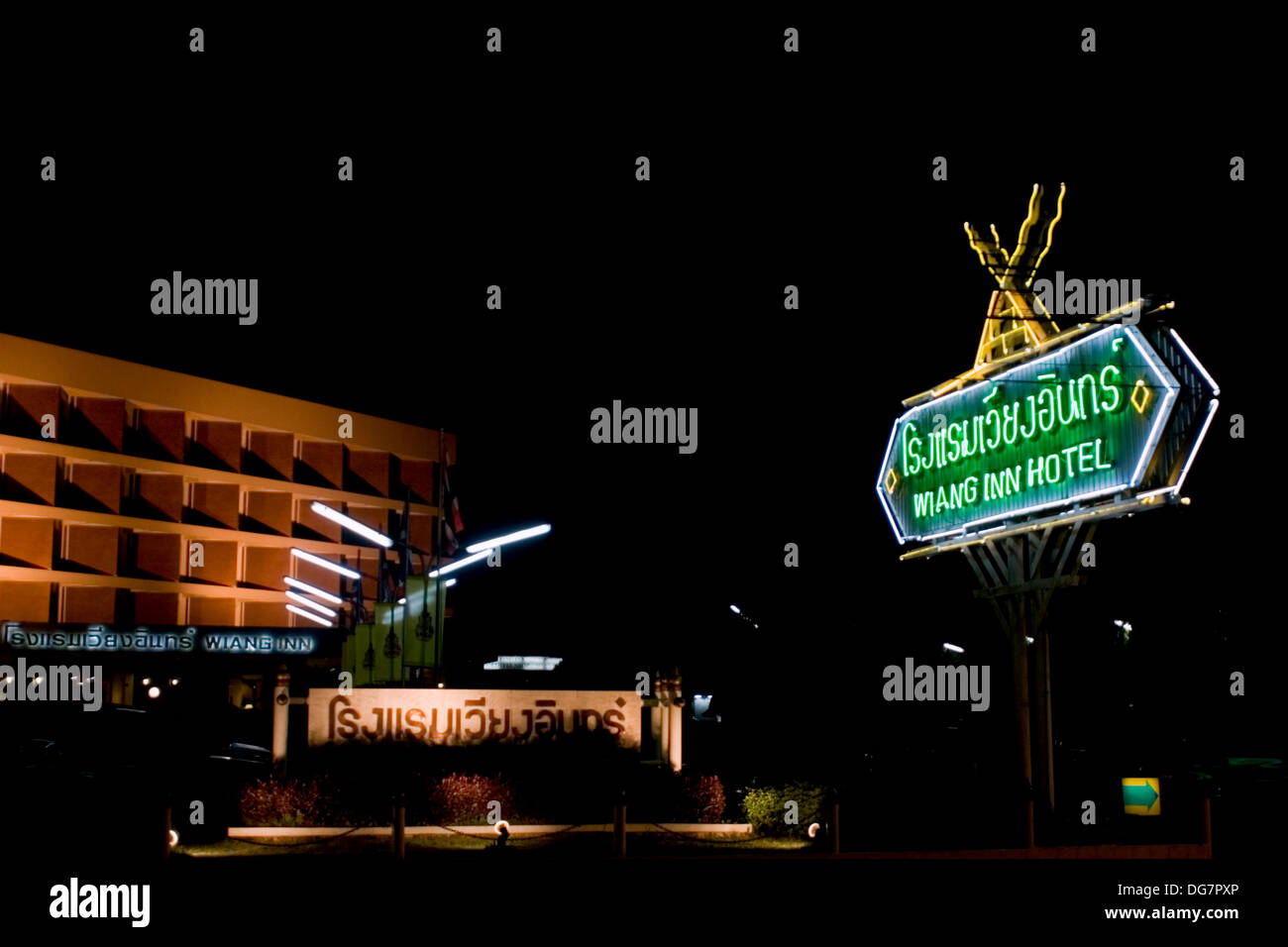 A large neon sign marks the location of the Wiang Inn Hotel in Chiang ...