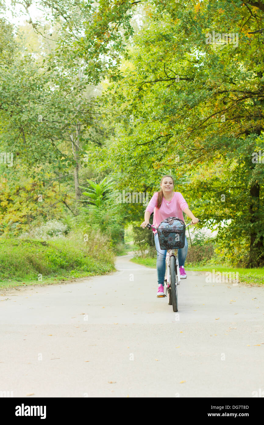 Student girl riding bicycle outdoor Stock Photo - Alamy