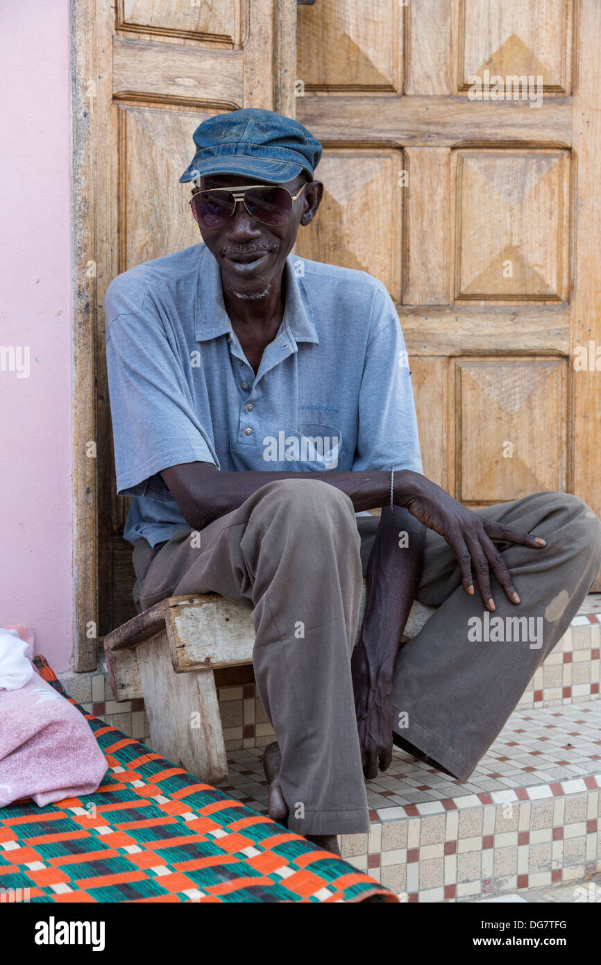 Senegal, Saint Louis. Middle-aged Senegalese Man Sitting at his Front ...