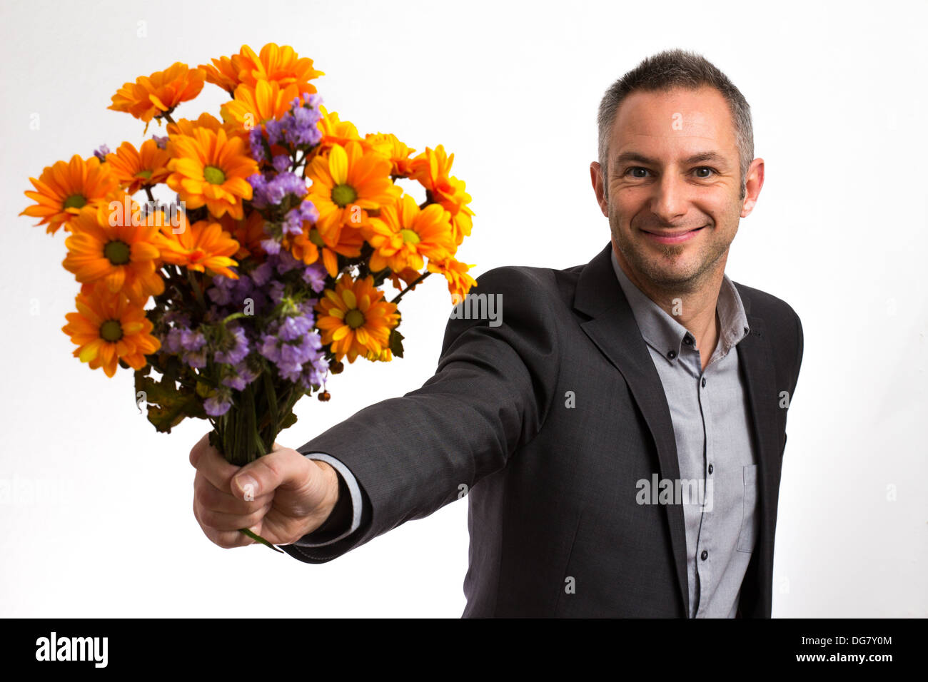 Man with bunch of flowers Stock Photo - Alamy