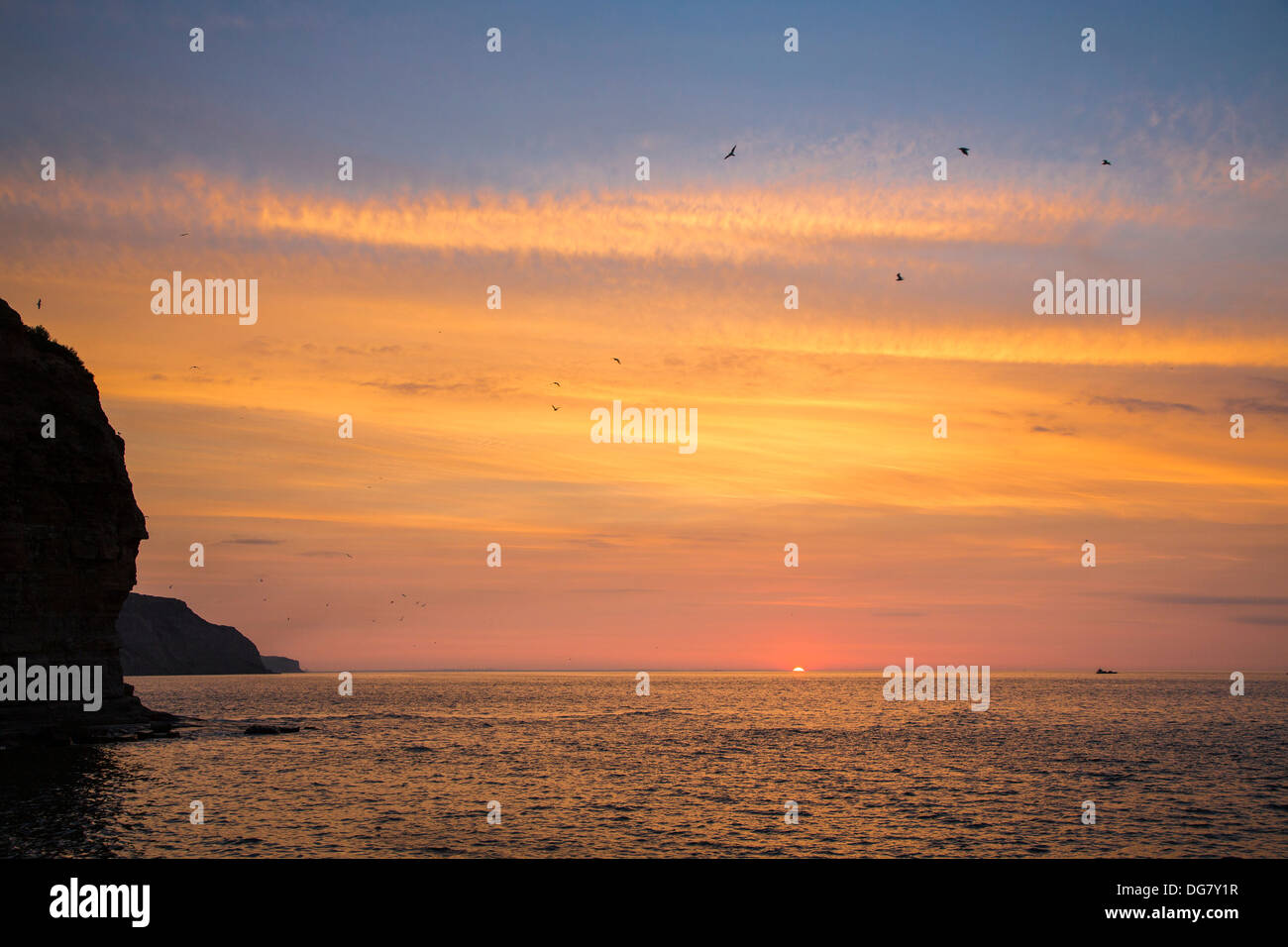 Sunset from Staithes looking towards Boulby Cliffs Stock Photo - Alamy