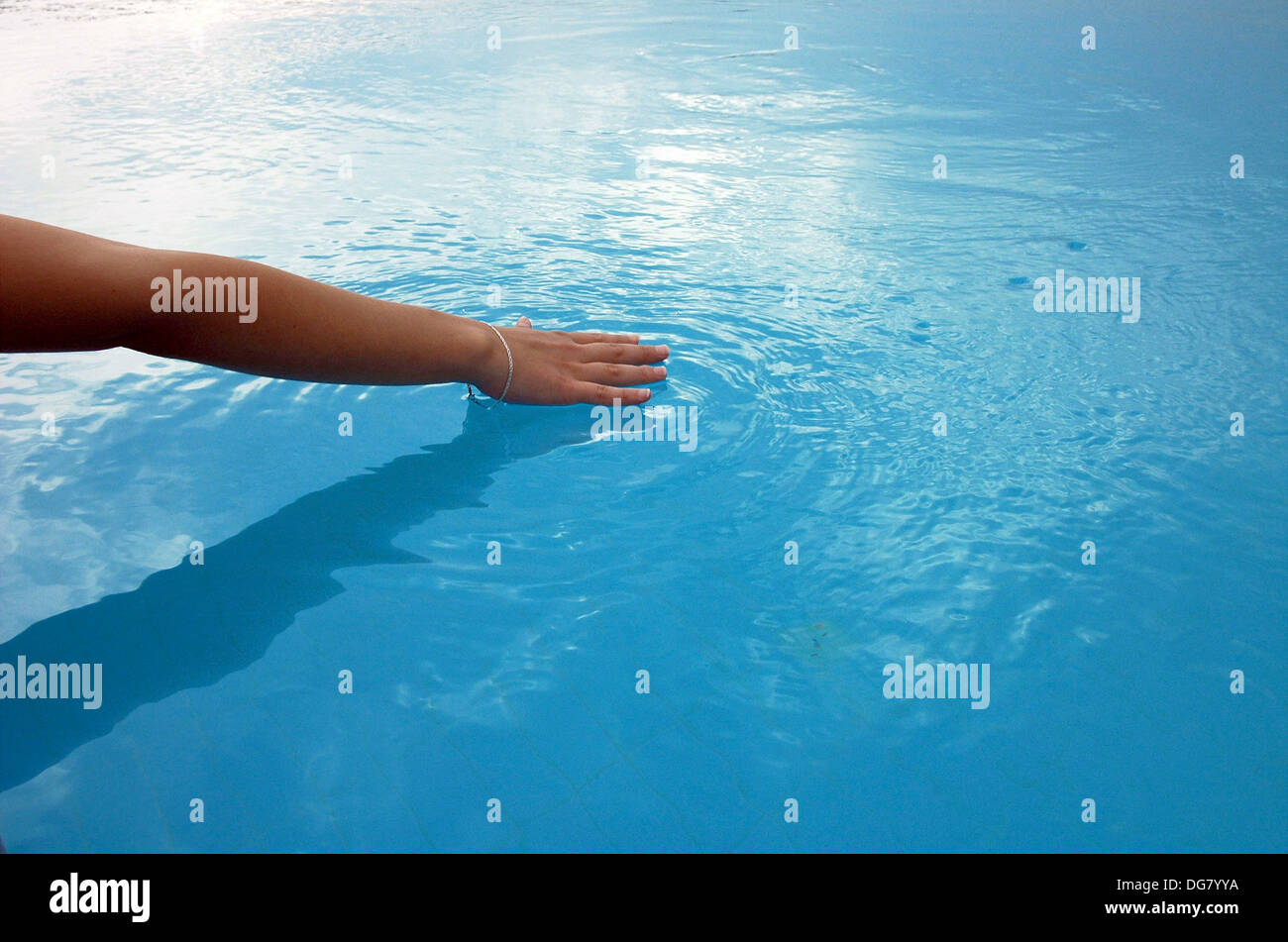 woman´s hand touching the water Stock Photo - Alamy