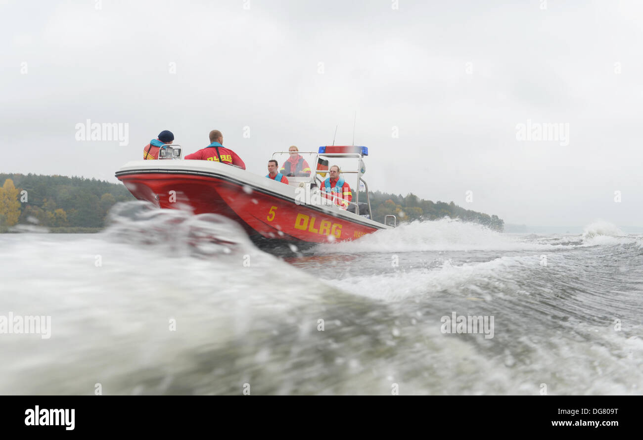 Berlin, Germany. 16th Oct, 2013. A DLRG boat crews sail in rescue boats ...