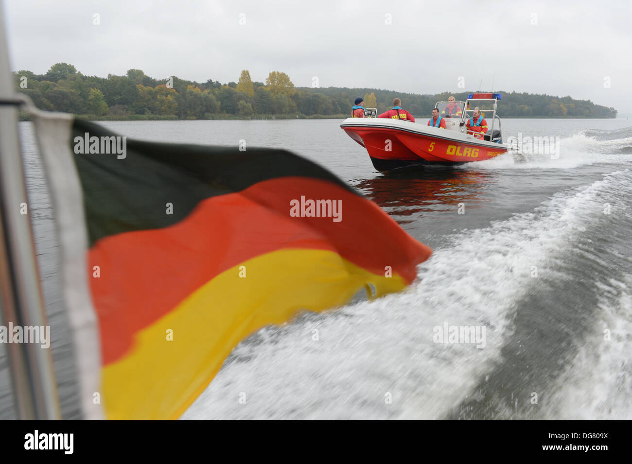 Berlin, Germany. 16th Oct, 2013. A DLRG boat crews sail in rescue boats ...