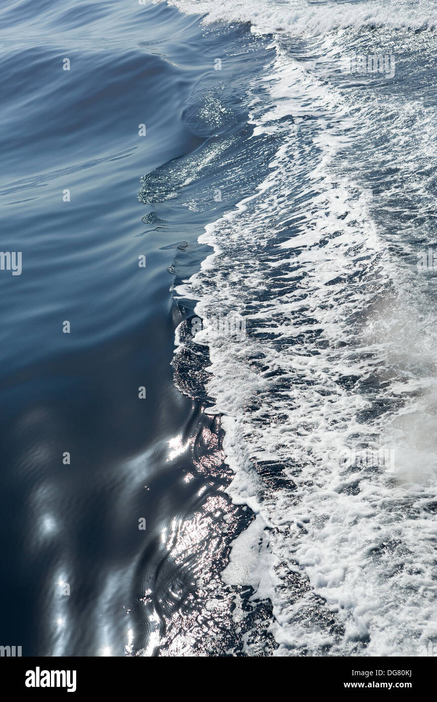 Trace on the sea water after ship Stock Photo - Alamy