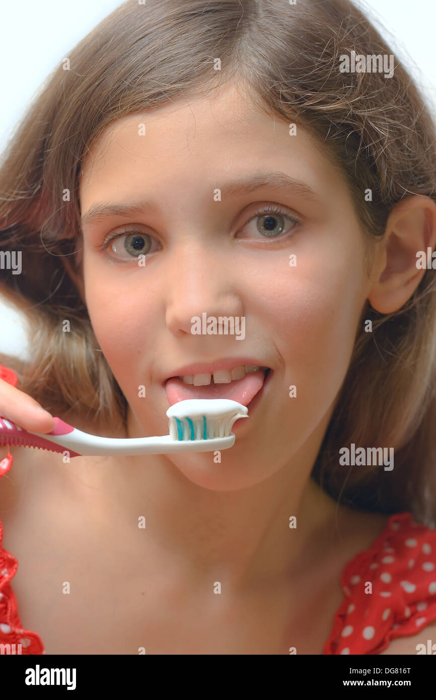 Beauty teen girl clean teeth isolated on white Stock Photo - Alamy