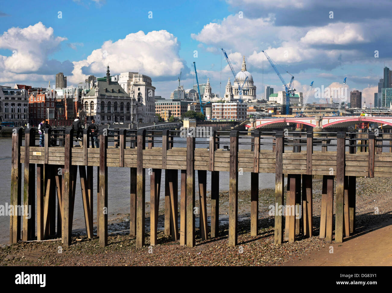 Wooden jetty Pier on river Thames St Pauls in background London skyline ...