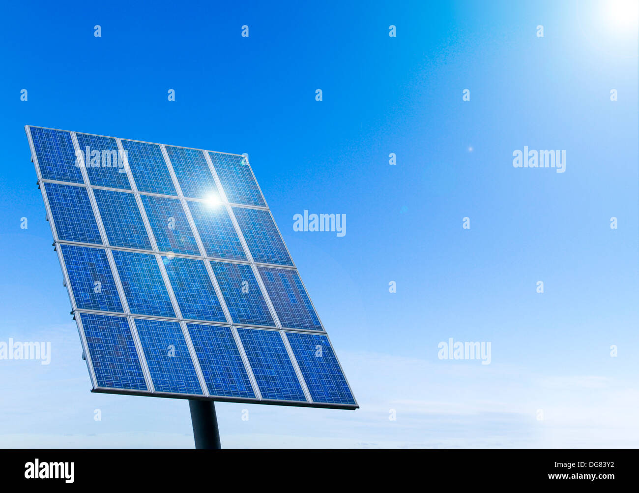 Sun shining in a solar panel against a blue sky Stock Photo - Alamy